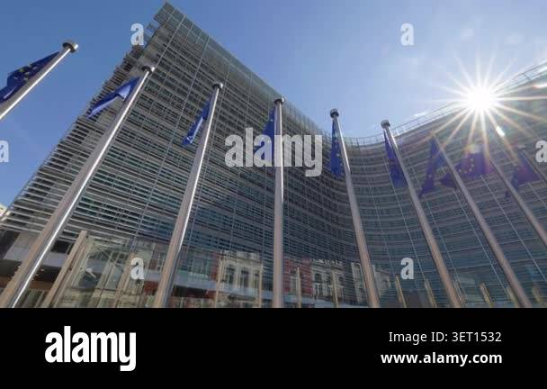 BRUSSELS, BELGIUM - SEPTEMBER 27 2025: Row of poles with EU flags near ...