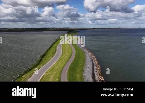 Aerial drone view of the recently completed dike reinforcement project ...