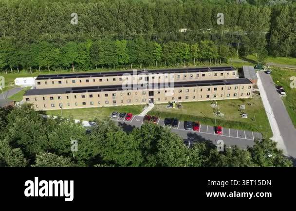 High angle drone footage reveals a contemporary prefabricated housing ...