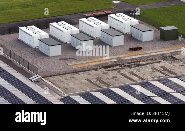 Aerial drone view of a BESS facility storing solar and wind power ...