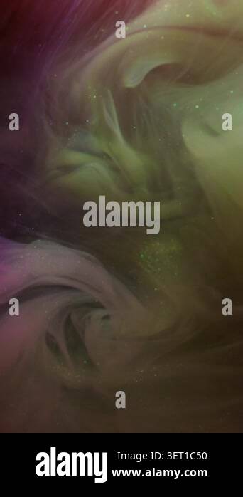 Vertical video. Color mix. Ink background. Defocused purple yellow ...