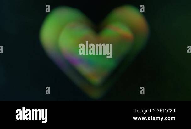 Heart geometric. Blur love rainbow. Defocused green neon purple color ...