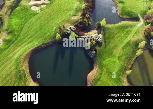 Aerial landscape of golf course with water and trees Stock Video ...