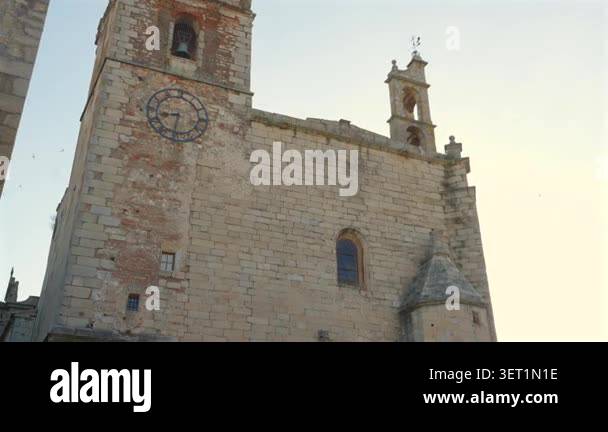 Low angle view of medieval church tower in the old town of Caceres ...