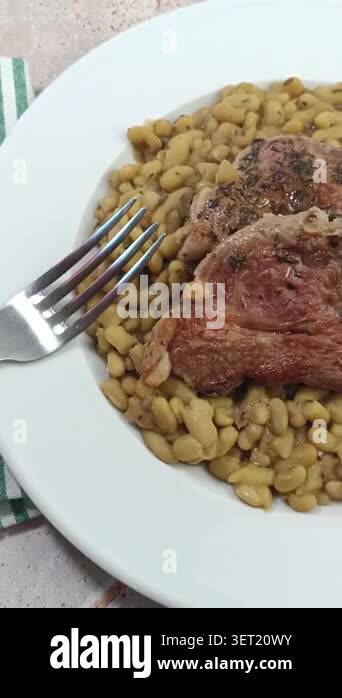 lamb chop and flageolet bean stew in close-up Stock Video Footage - Alamy