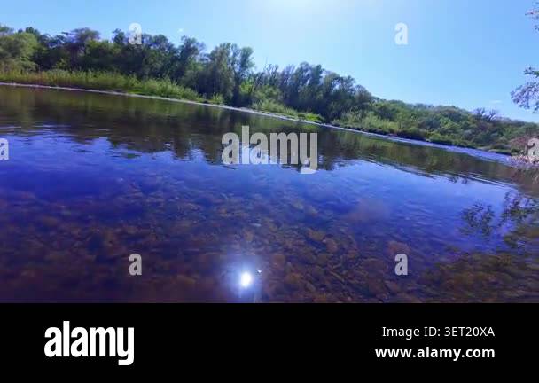 turbulent flow mountain stream biotope, green algae bloom in low ...