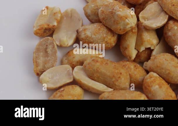 Salted roasted peanuts isolated on a white background Stock Video ...