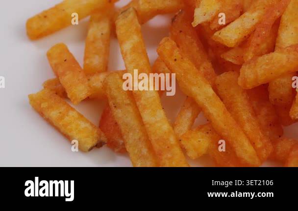 Paprika-flavored potato chip sticks, isolated on a white background ...