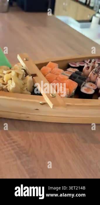 Decorative serving vessel showcases handcrafted japanese delicacies ...
