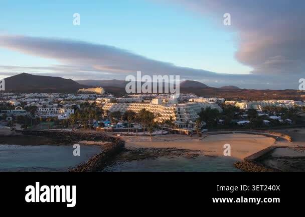 Experience stunning views of Lanzarotes volcanoes from the beach in ...