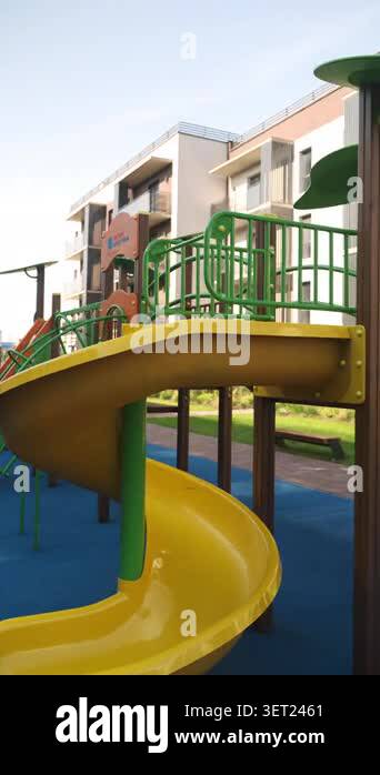 Modern and colorful playground equipment in the courtyard of a new ...