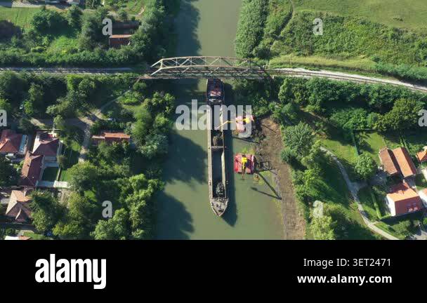 Above view on two excavators dredge as they dredging, working on river ...