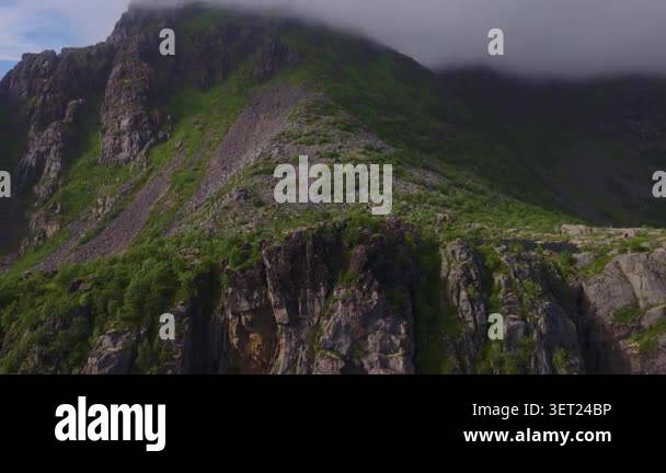 Stunning aerial view of towering basalt cliffs in Lofoten, Norway, with ...