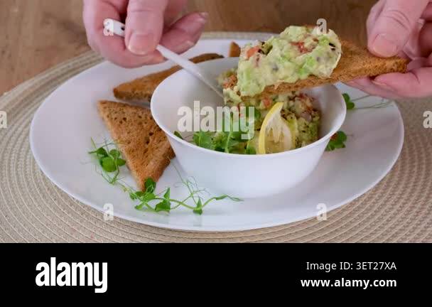 Making Avocado Toast with Fresh Guacamole at Home Stock Video Footage ...
