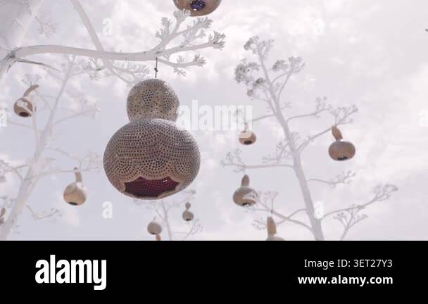 Unique outdoor decoration featuring handcrafted calabash gourd lamps ...
