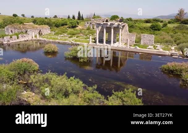Scenic aerial flight around the flooded ruins of the ancient city of ...