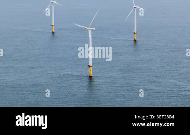 Aerial drone close up of an offshore wind turbine near Redcar ...