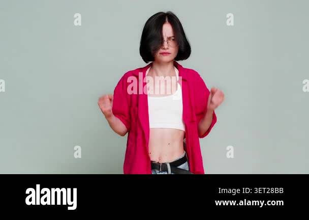 Young woman waves hands dramatically rolls eyes showing clear signs of ...