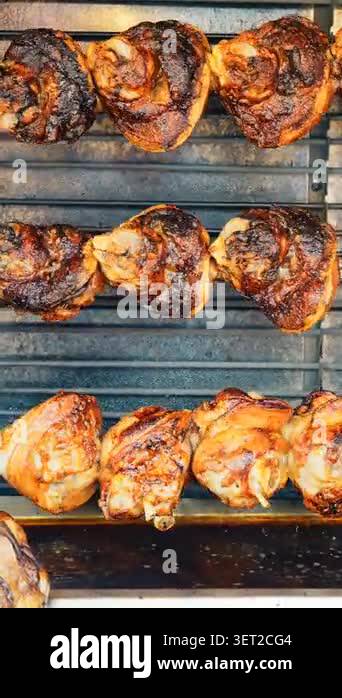 Vertical close-up of multiple roasted pork knuckles arranged on three ...