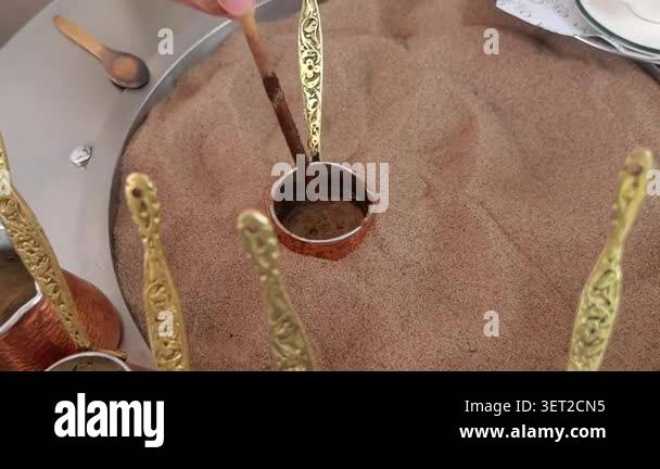 Making turkish coffee in sand at a traditional coffee stand Stock Video ...