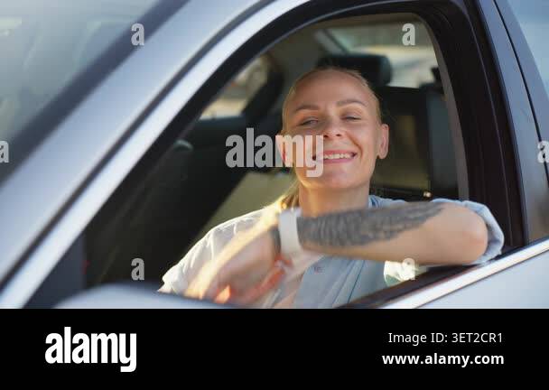 young woman in car, driving Stock Video Footage - Alamy