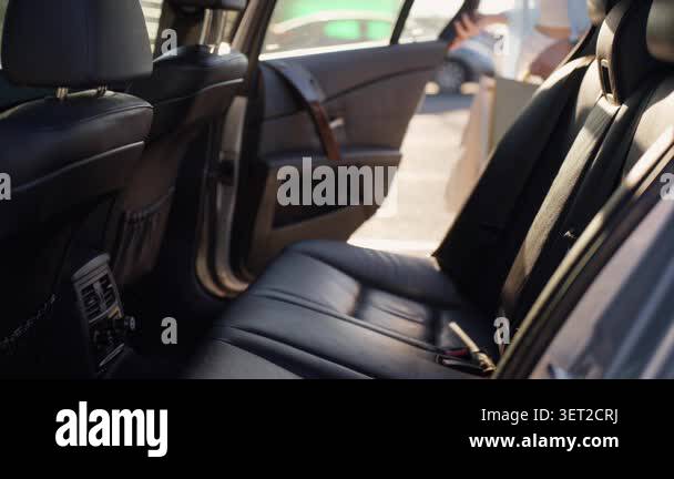 woman sitting in car trunk, close - up view Stock Video Footage - Alamy