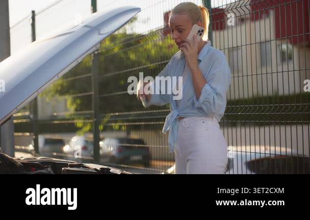 woman using broken car after breakdown at the roadside Stock Video ...