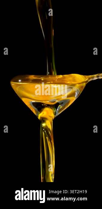 Golden Flaxseed Oil Flowing into Spoon in Slow Motion Stock Video ...