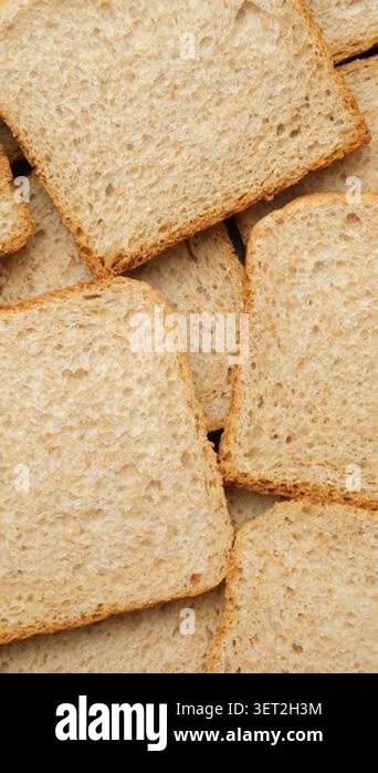 Top view of whole wheat toast bread slices rotating slowly Stock Video ...