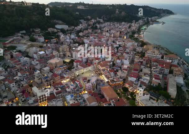 Cinematic night view of Zakynthos Town harbor. Aerial shot of the ...