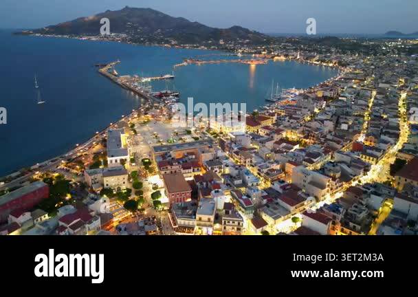 Cinematic night view of Zakynthos Town harbor. Aerial shot of the ...