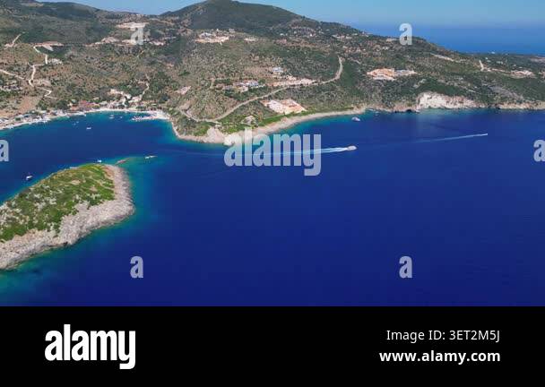 Scenic view of Agios Nikolaos port in Zakynthos with crystal blue water ...