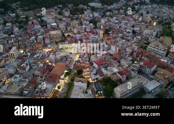 Cinematic night view of Zakynthos Town harbor. Aerial shot of the ...