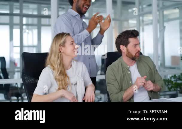 Joyful carefree corporate group business team dancing doing same ...