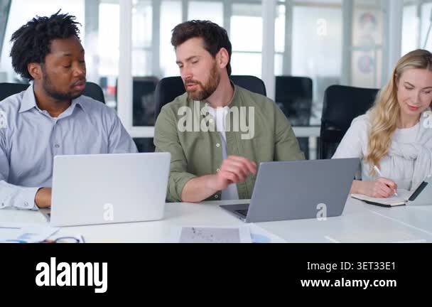 Business team group three multiethnic business partners talking working ...