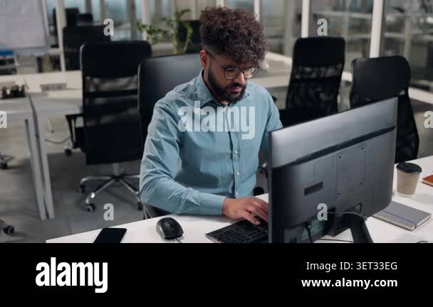 Arabian ethnic business man working with modern technology typing ...