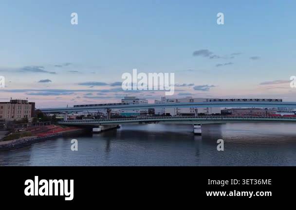 An aerial view of the Tokyo Bay waterfront, bridges and modern skyline ...