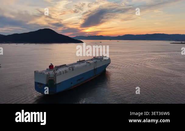 An aerial view of a large cargo ship sailing the Seto Inland Sea at ...