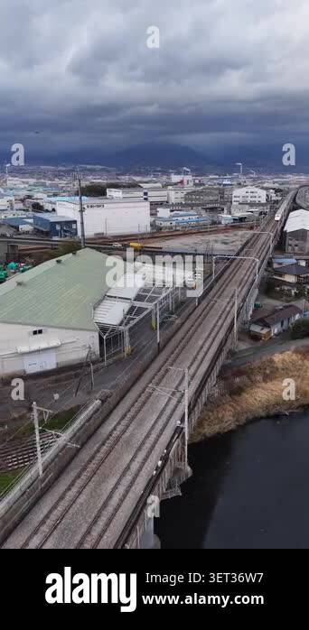 An aerial view of a coastal industrial town, harbour and breakwaters by ...