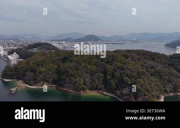 An aerial view of the city, harbour and industrial port of Hiroshima by ...