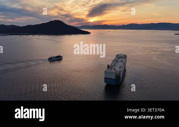 An aerial view of a large cargo ship sailing the Seto Inland Sea at ...