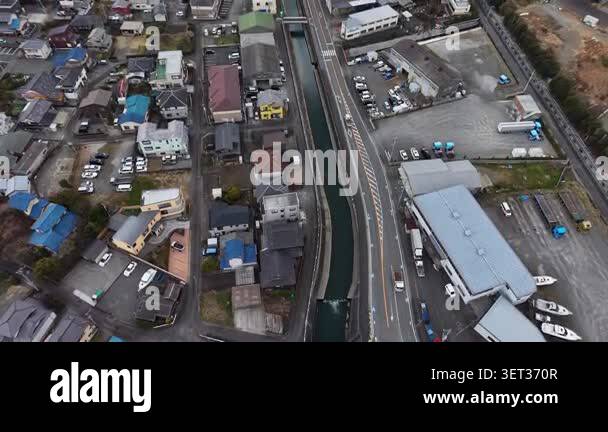 An aerial view of a coastal industrial town, harbour and breakwaters by ...