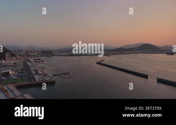 An aerial view of a large cruise liner docked in the harbour by the ...