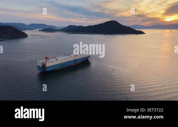 An aerial view of a large cargo ship sailing the Seto Inland Sea at ...