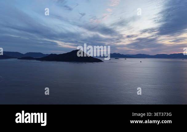 An aerial view of a large cargo ship sailing the Seto Inland Sea at ...