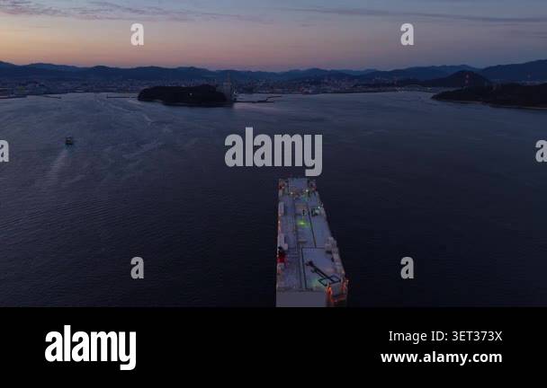An aerial view of a large cruise liner docked in the harbour by the ...