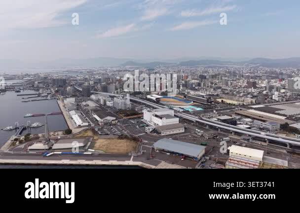 An aerial view of the city, harbour and industrial port of Hiroshima by ...