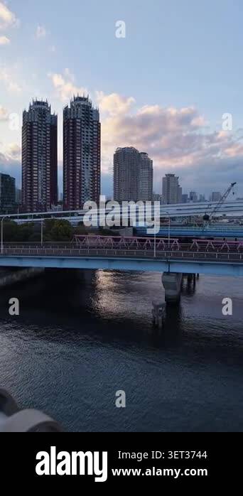 An aerial view of the Tokyo Bay waterfront, bridges and modern skyline ...
