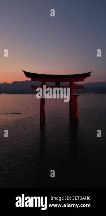 The iconic red floating torii gate of Itsukushima Shrine illuminated at ...