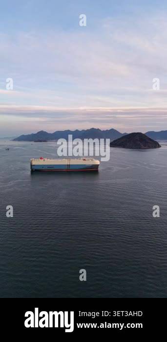 An aerial view of a large cargo ship sailing the Seto Inland Sea at ...